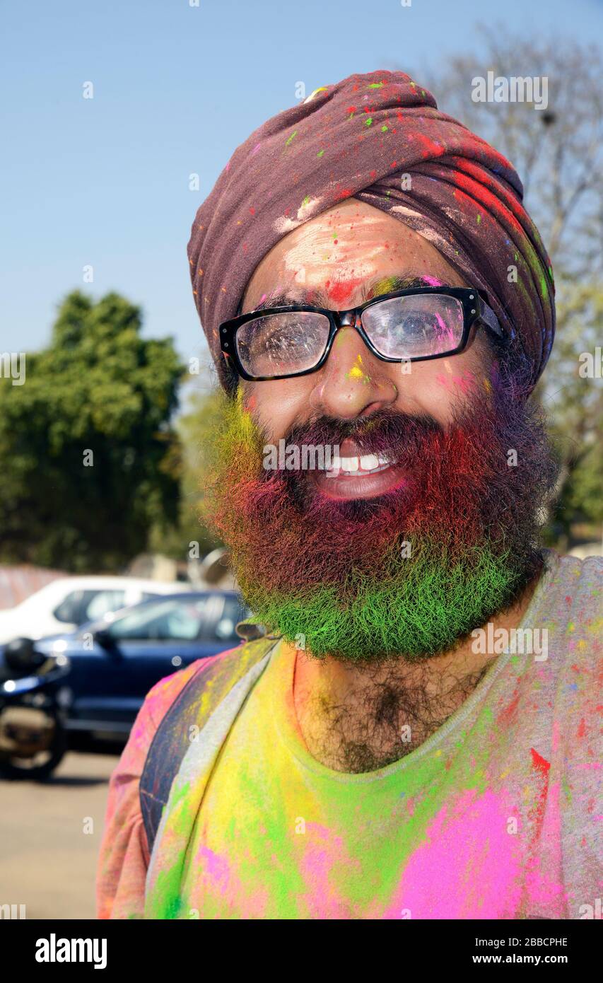 Portrait Of Indian young man With Colored Face Stock Photo - Alamy