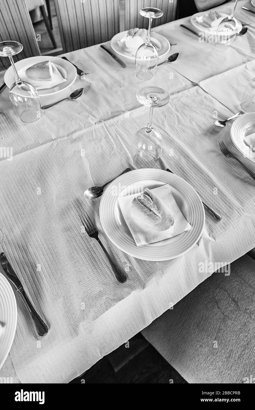 Restaurant table to detail of a dining table, dishes and silverware for ...