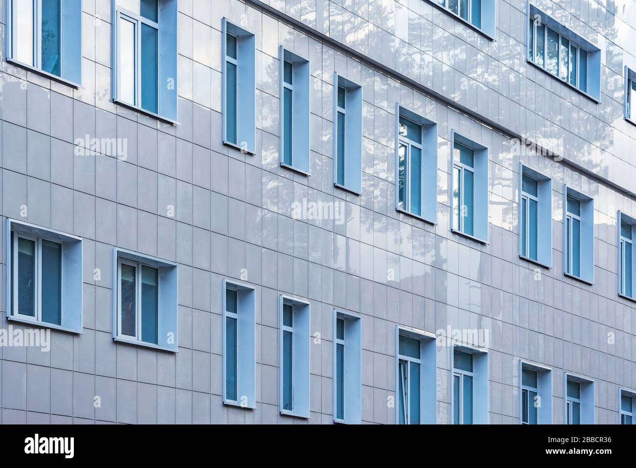 Exterior of the office building at evening time Stock Photo - Alamy