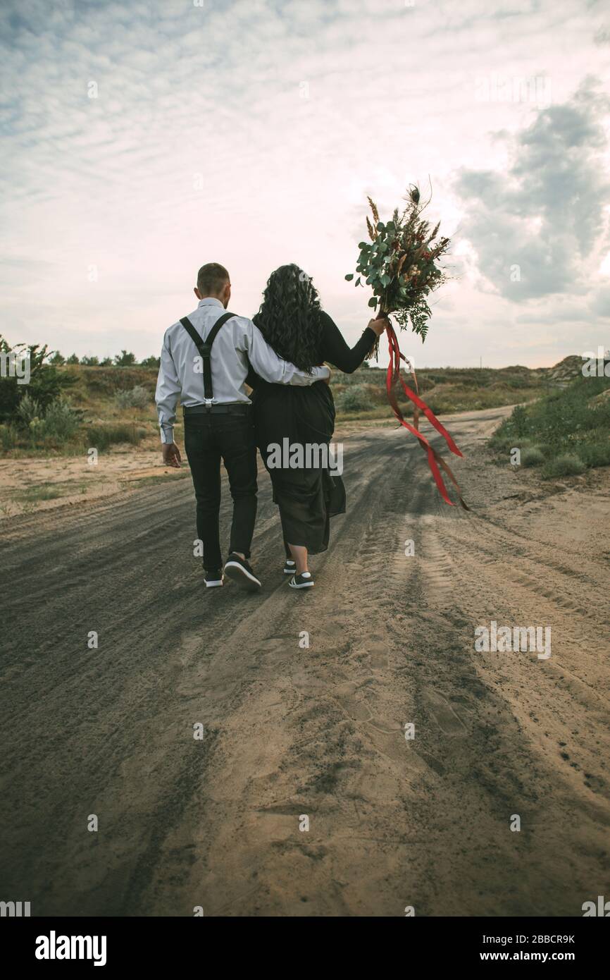 Man and woman on the road Stock Photo - Alamy