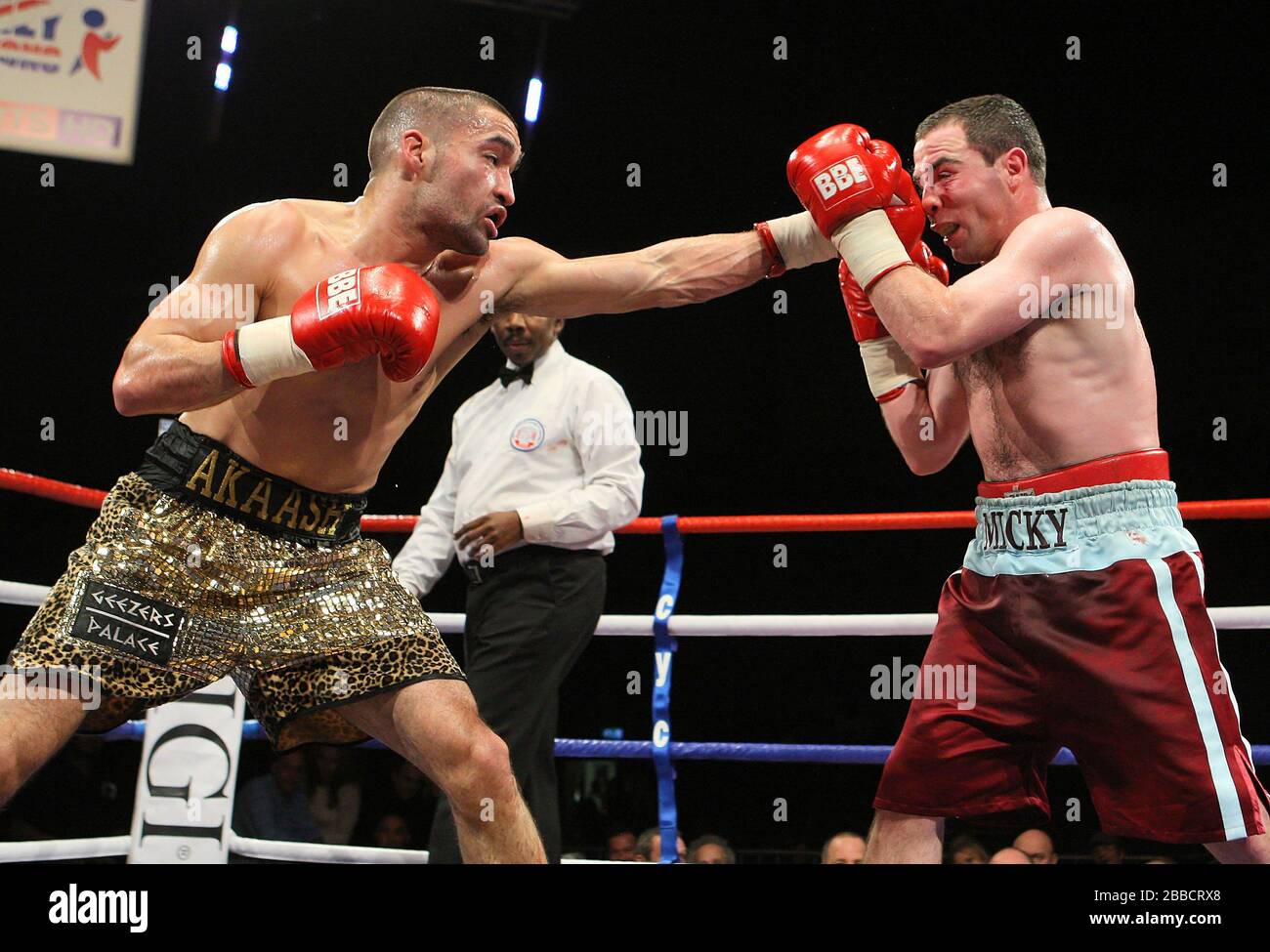 Akaash Bhatia (gold shorts) defeat Mickey Coveney in a Featherweight ...