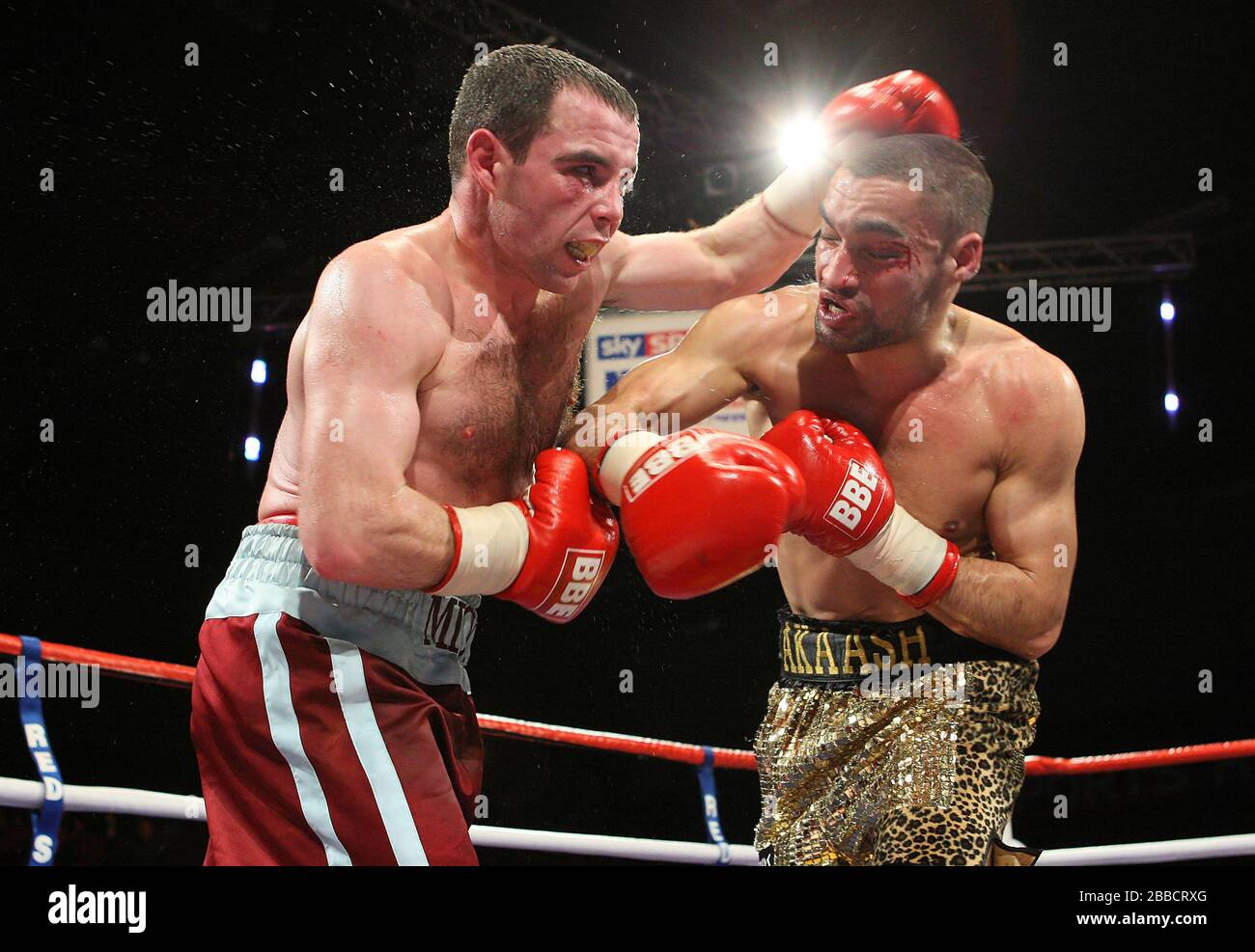Akaash Bhatia (gold shorts) defeat Mickey Coveney in a Featherweight ...