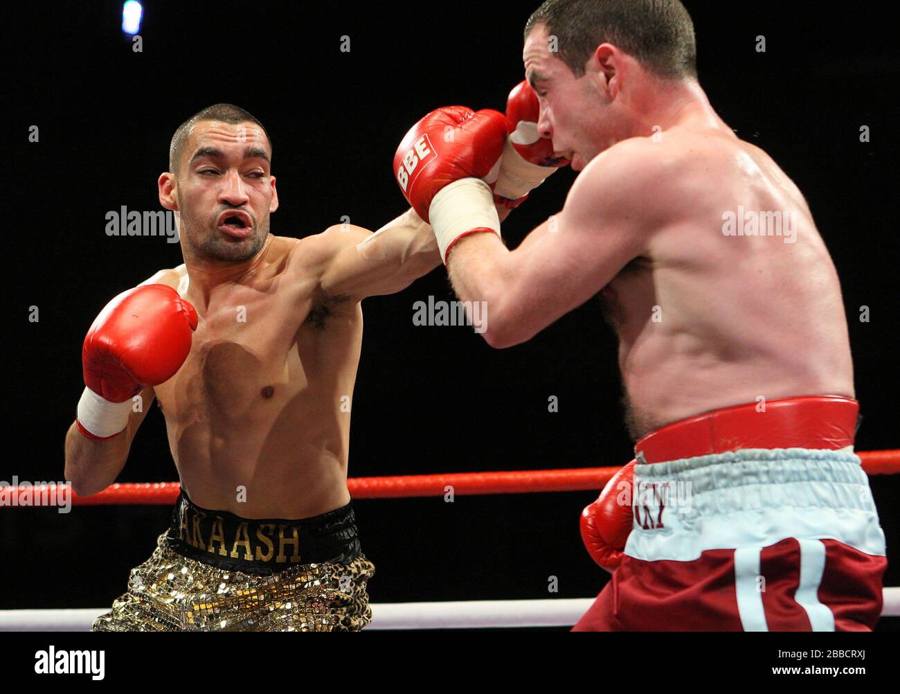Akaash Bhatia (gold shorts) defeat Mickey Coveney in a Featherweight ...