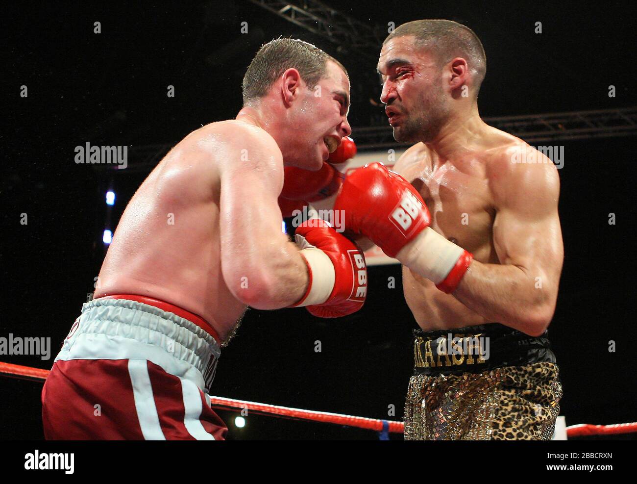 Akaash Bhatia (gold shorts) defeat Mickey Coveney in a Featherweight ...