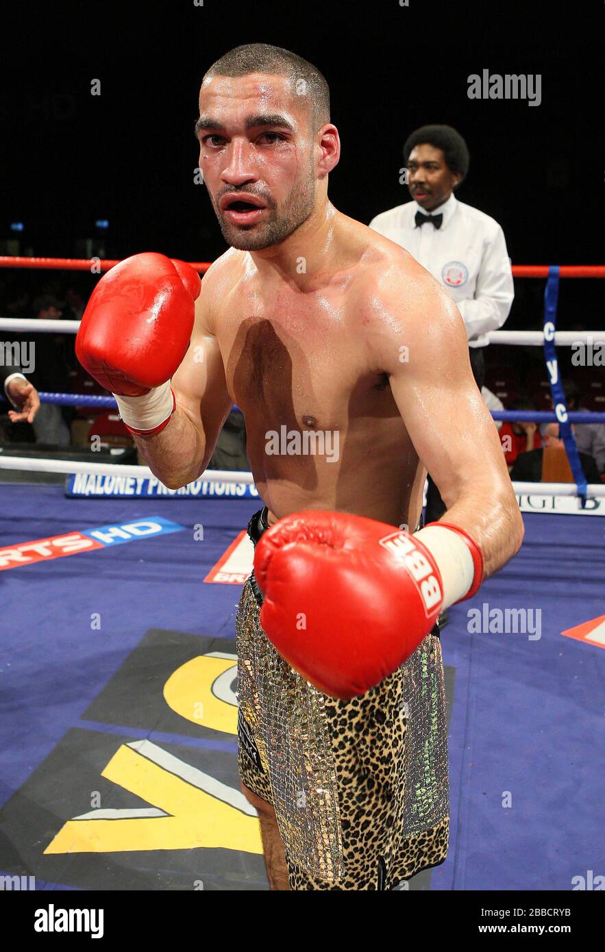 Akaash Bhatia (gold shorts) defeat Mickey Coveney in a Featherweight ...