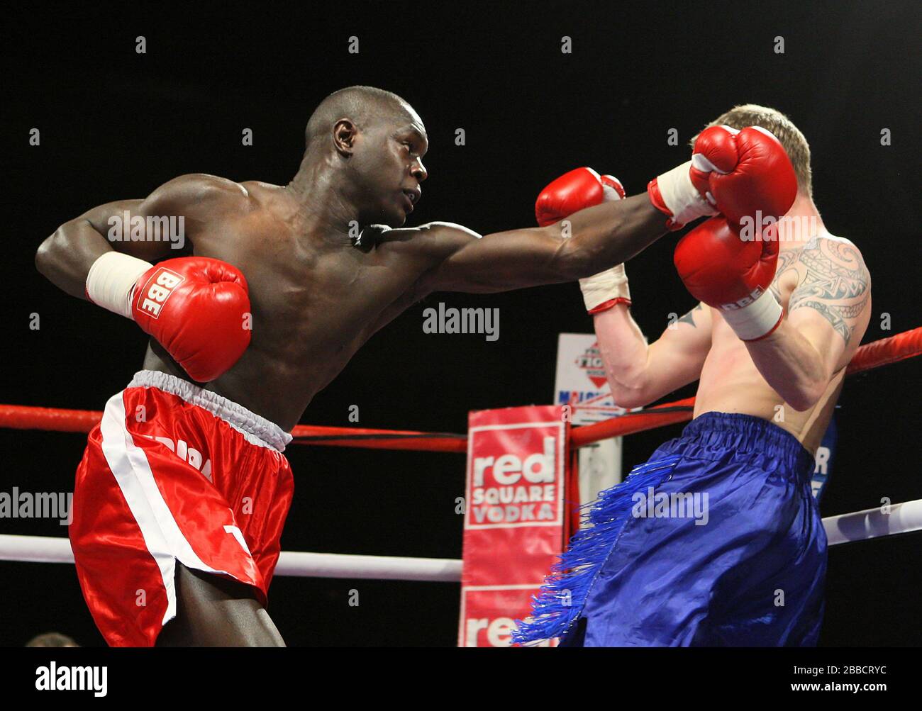 Erick Ochieng (red shorts) defeats Jon Harrison in a Super-Middleweight ...
