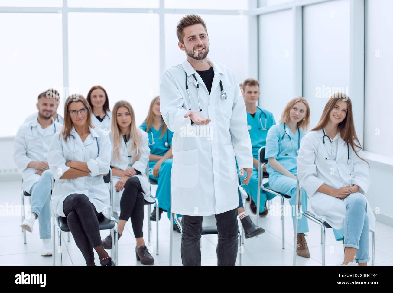 top view. a group of smiling doctors pointing at you Stock Photo - Alamy