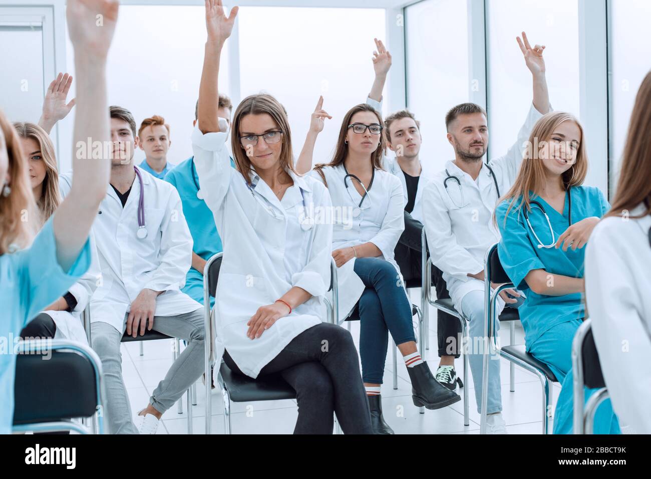 top view. a group of smiling doctors pointing at you Stock Photo - Alamy