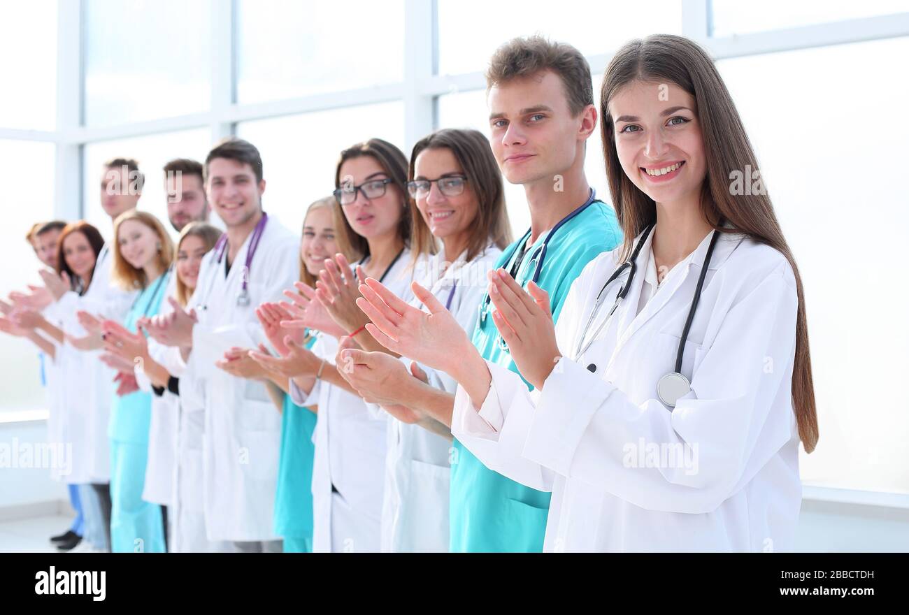 top view. a group of smiling doctors pointing at you Stock Photo - Alamy