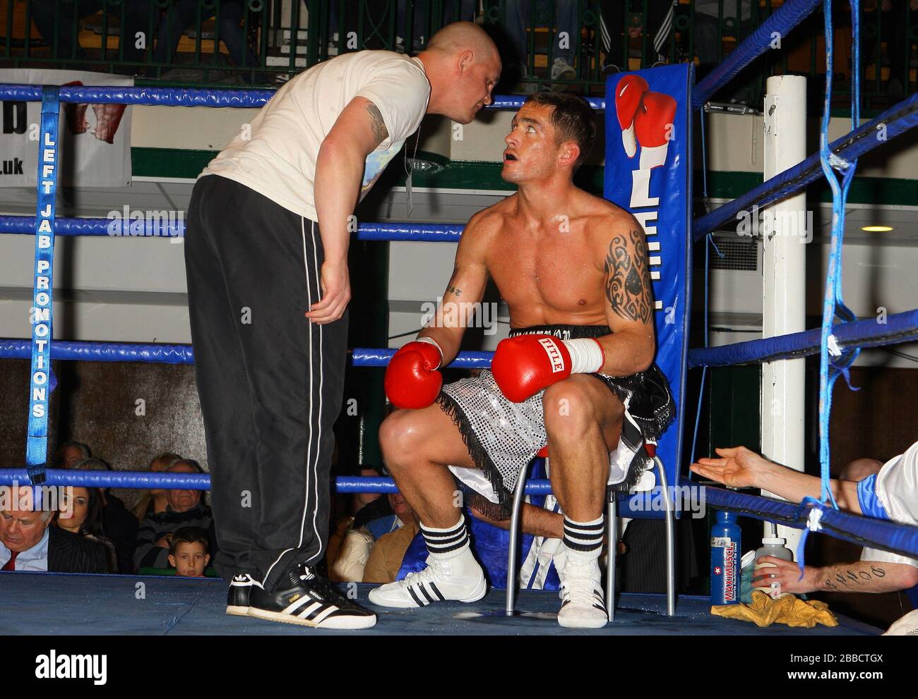 Tony Conquest (silver/black shorts) defeats John Anthony in a ...