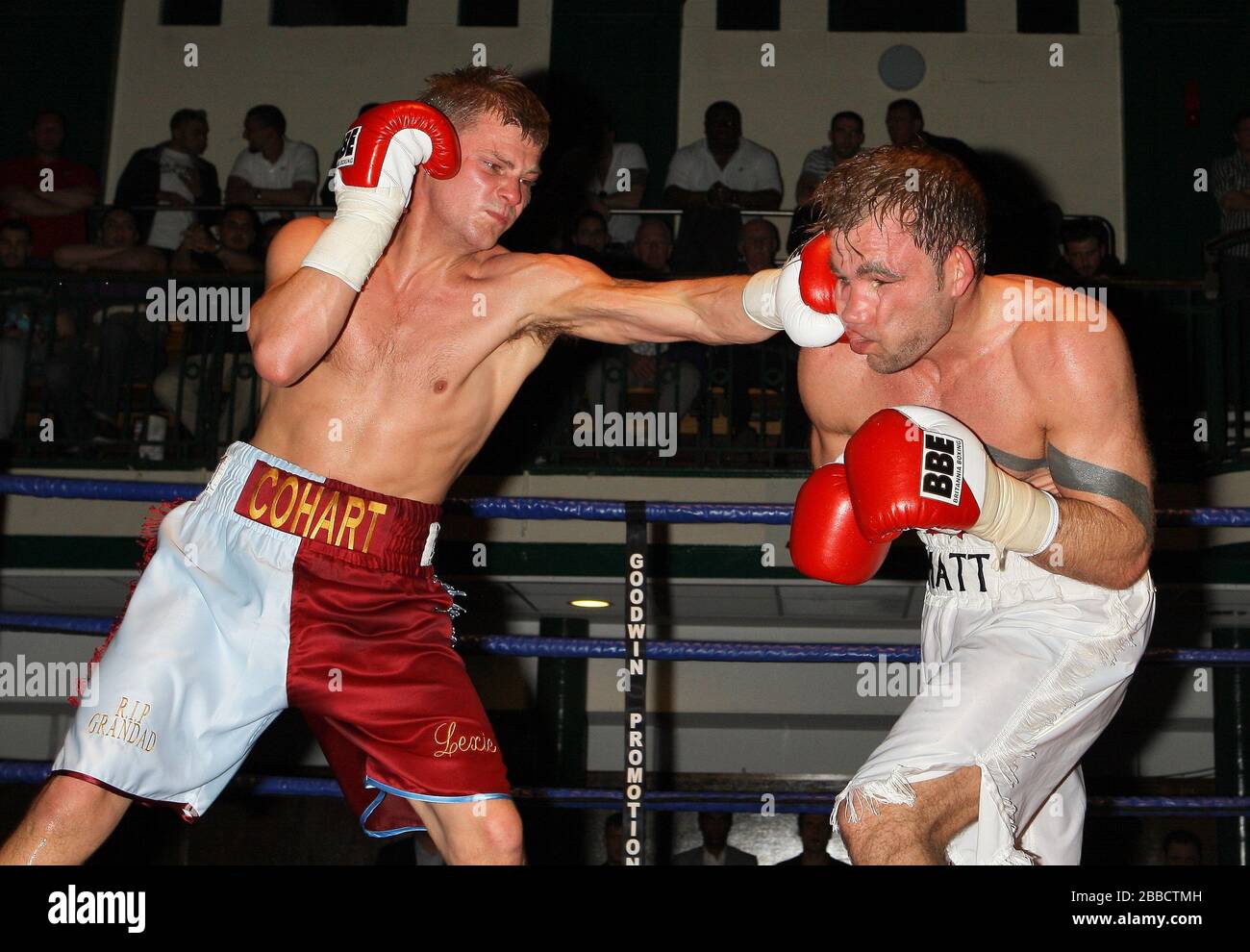 John Wayne Hibbert (claret/blue shorts) defeats Matt Scriven in a ...