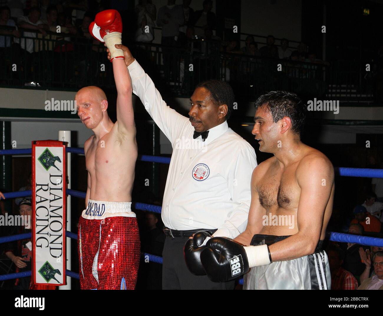 Ryan Barrett (red shorts) defeats Sid Razak in a Lightweight boxing ...