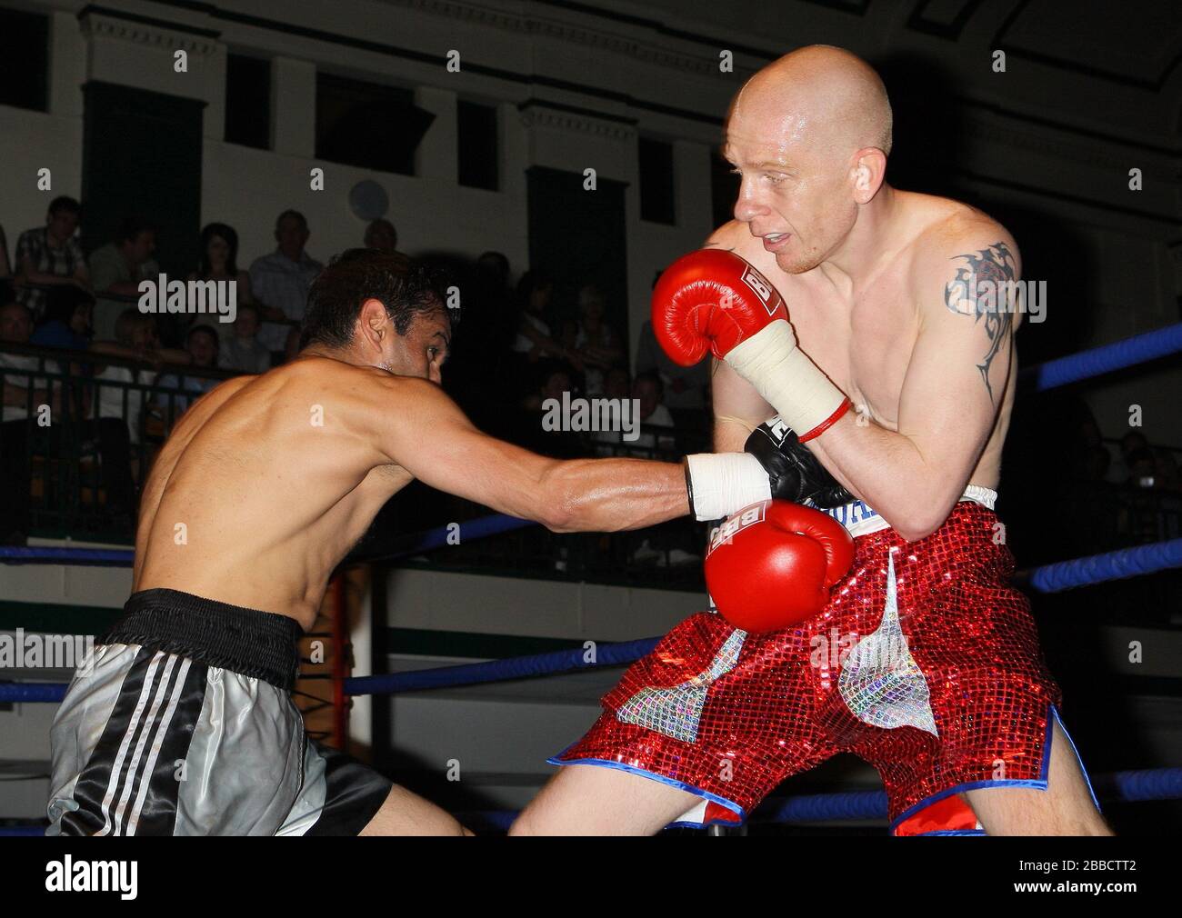 Ryan Barrett (red shorts) defeats Sid Razak in a Lightweight boxing ...