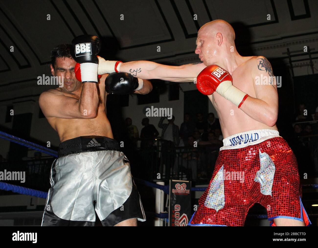 Ryan Barrett (red shorts) defeats Sid Razak in a Lightweight boxing ...