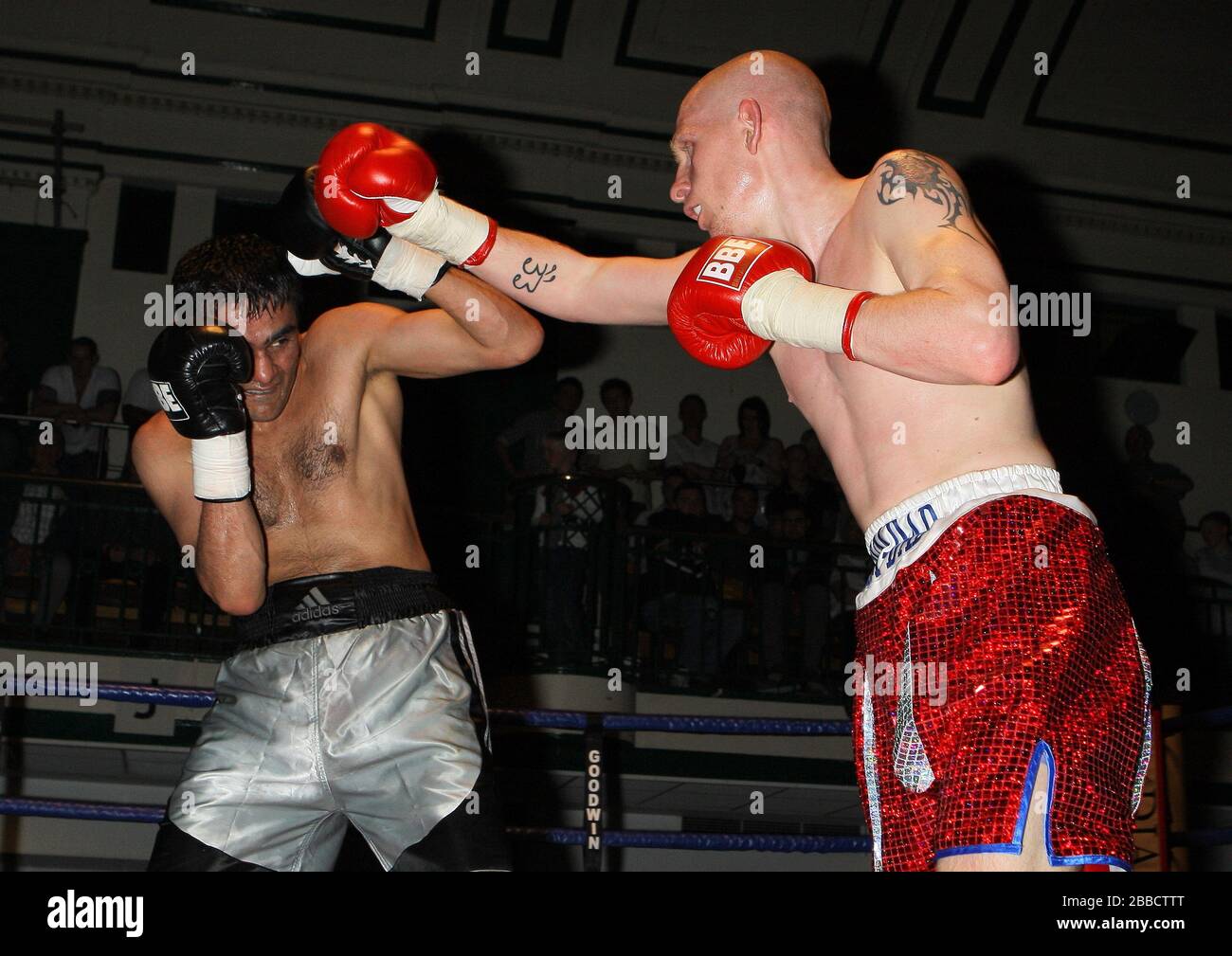 Ryan Barrett (red shorts) defeats Sid Razak in a Lightweight boxing ...