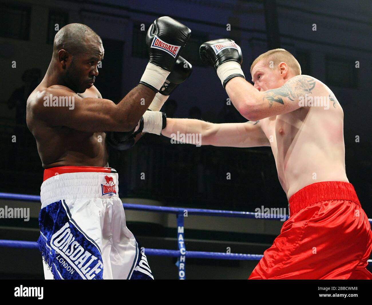 Round 1: Ted Bami (white shorts) defeats Andrew Ferrans (red shorts ...
