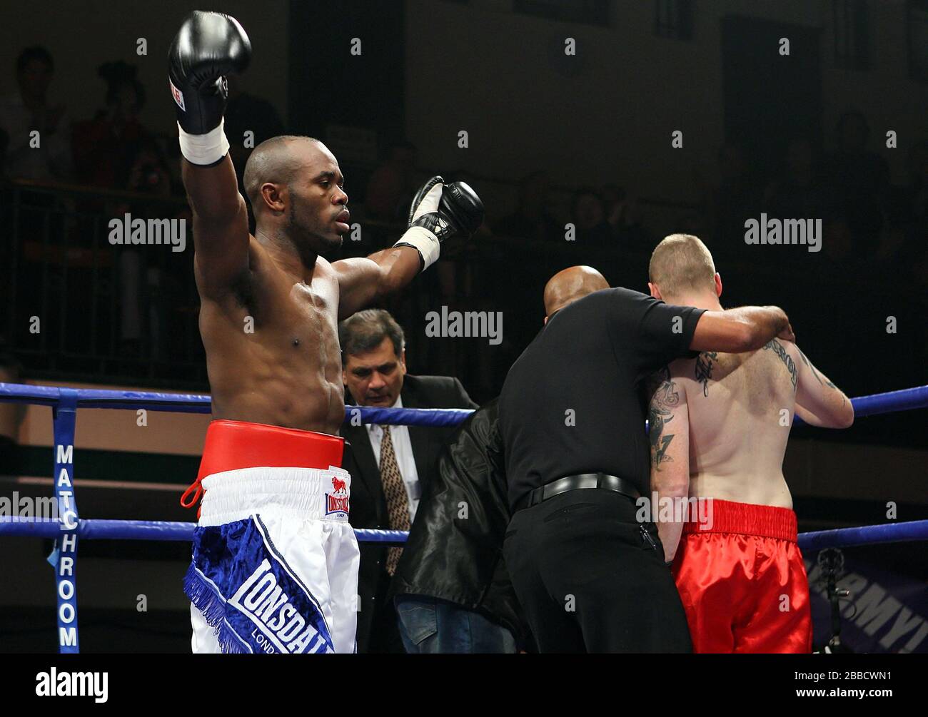 Round 1: Ted Bami (white shorts) defeats Andrew Ferrans (red shorts ...