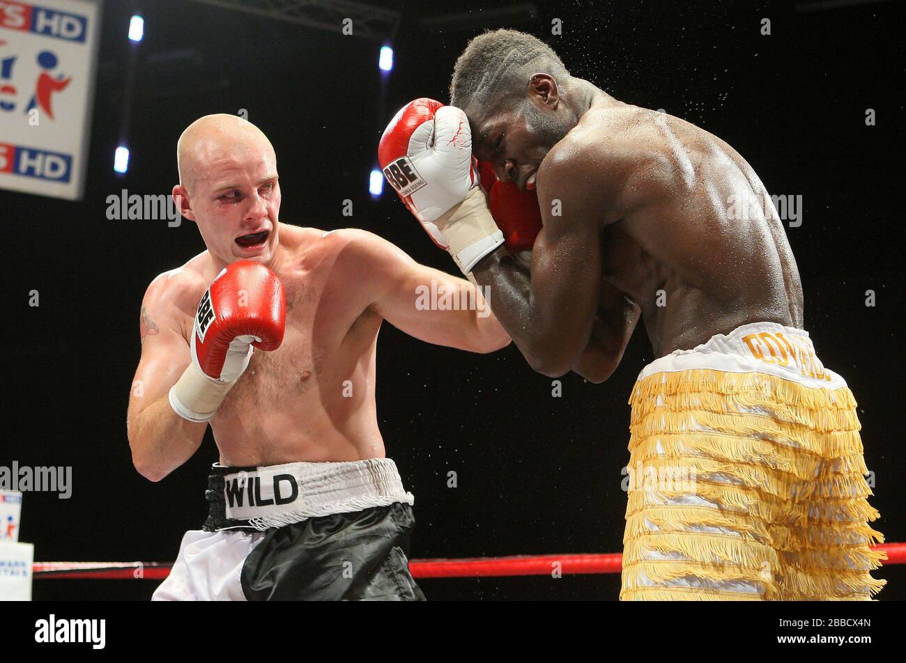 Menay Edwards (gold shorts) defeats Carl Wild in a Light-Heavyweight ...