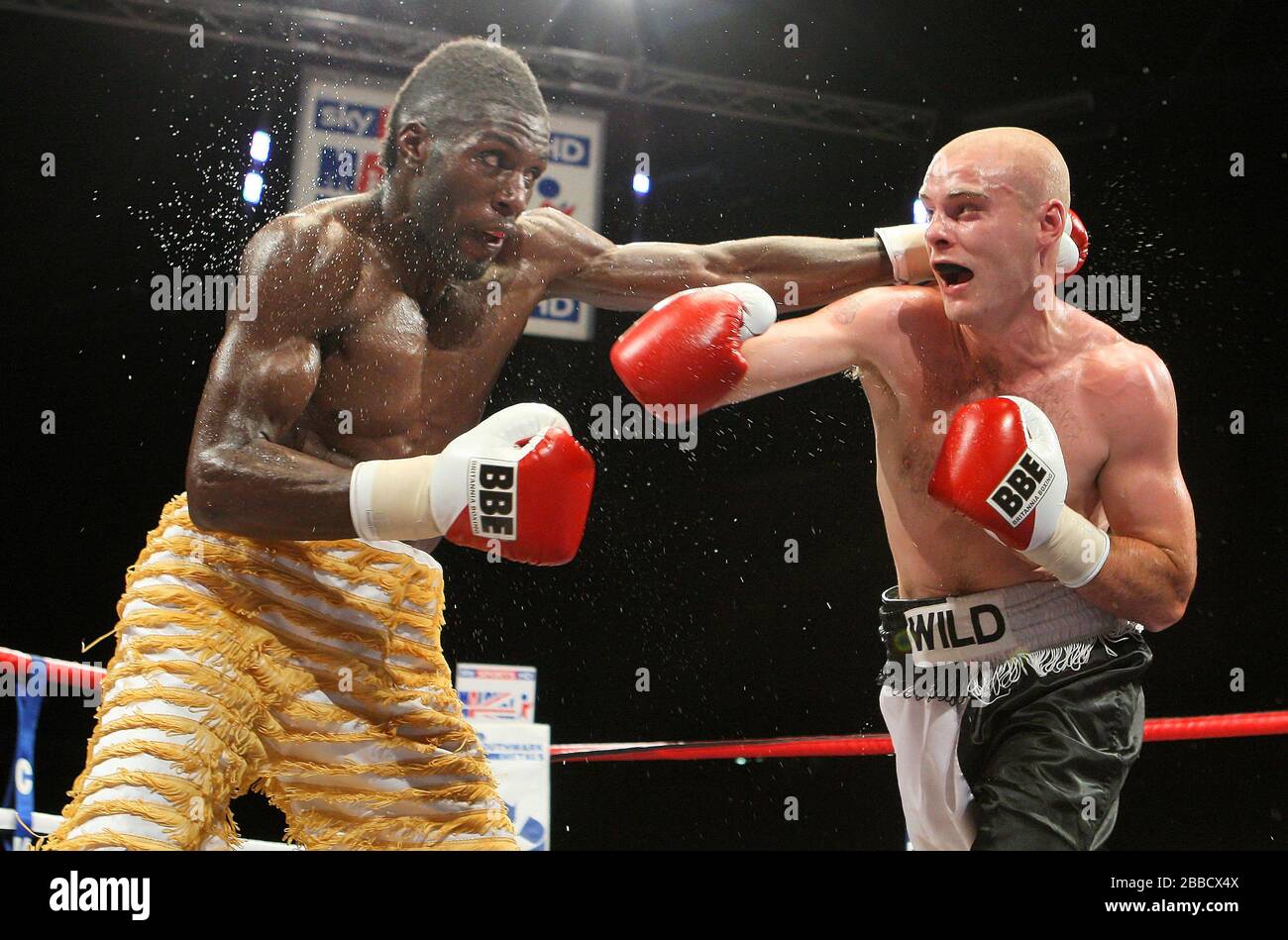Menay Edwards (gold shorts) defeats Carl Wild in a Light-Heavyweight ...