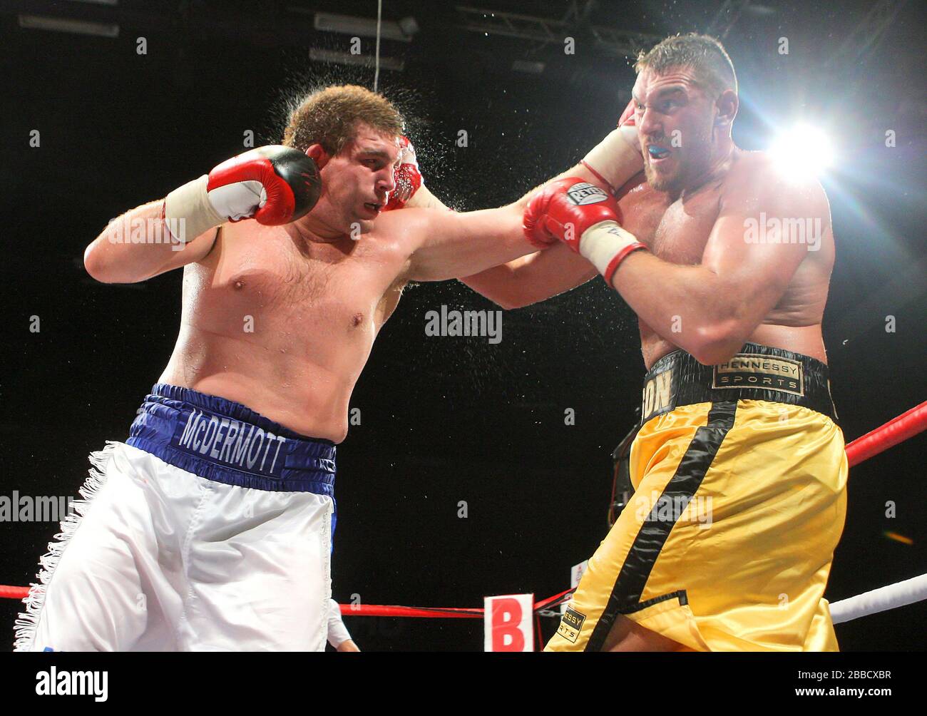 Tyson Fury (gold shorts) defeats John McDermott to win the English ...