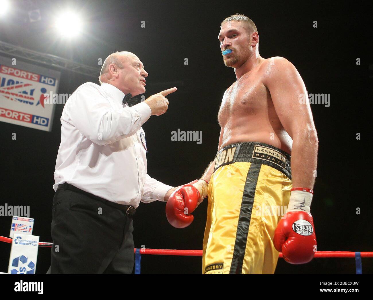 Tyson Fury (gold shorts) defeats John McDermott to win the English ...