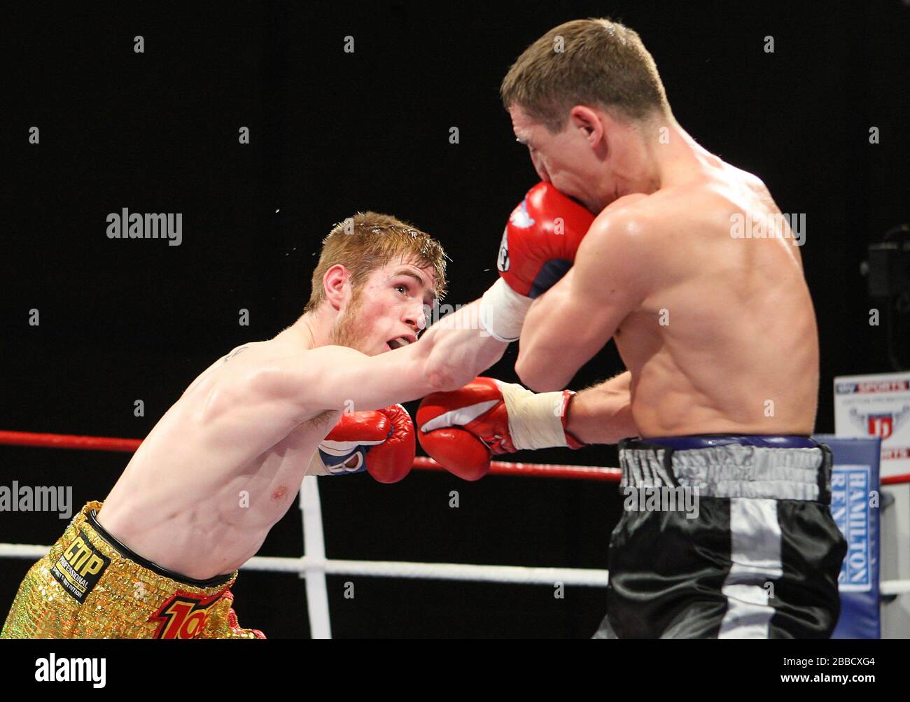 Joe Murray (gold shorts) defeats Yuri Voronin in a Super-Bantamweight ...