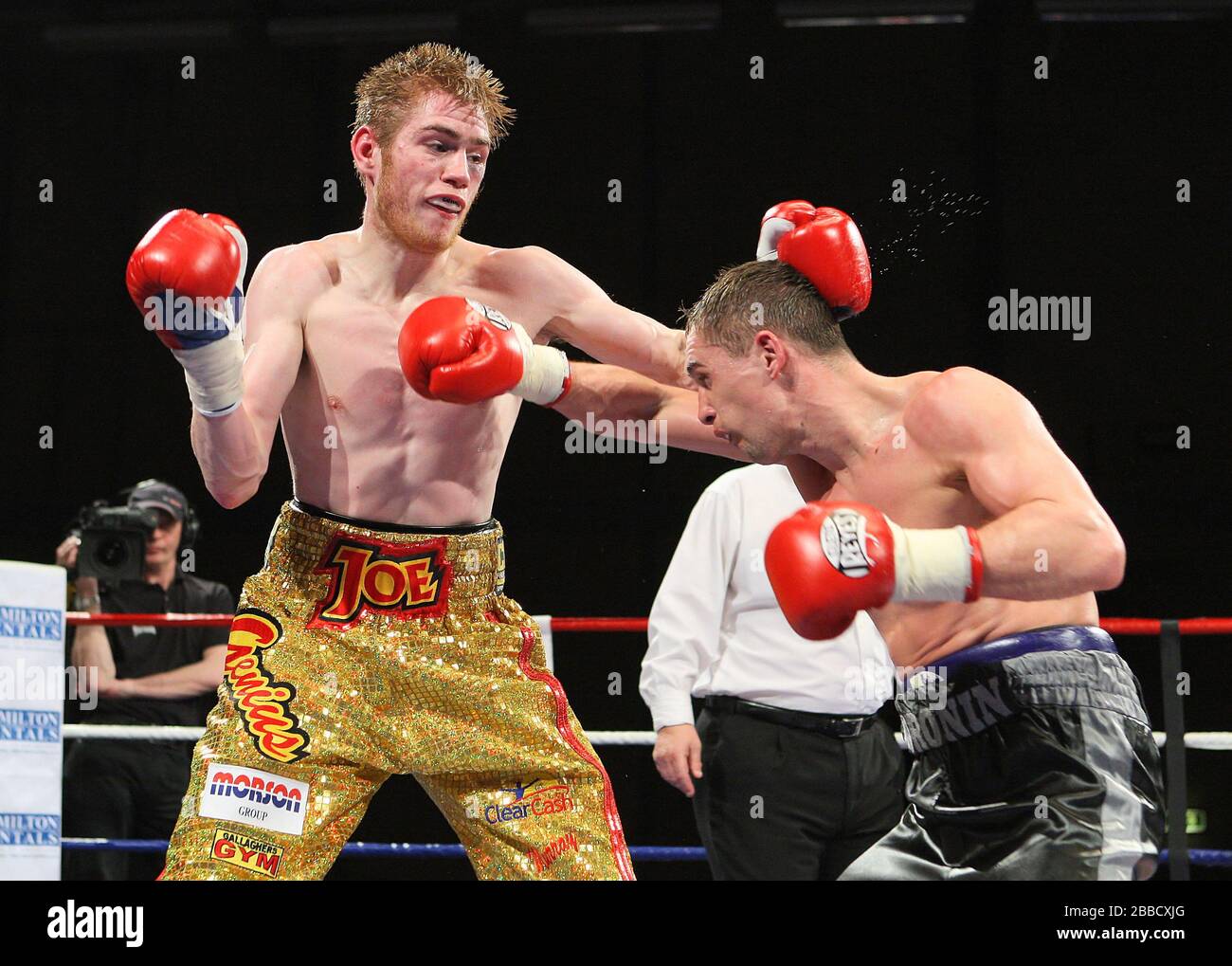 Joe Murray (gold shorts) defeats Yuri Voronin in a Super-Bantamweight ...