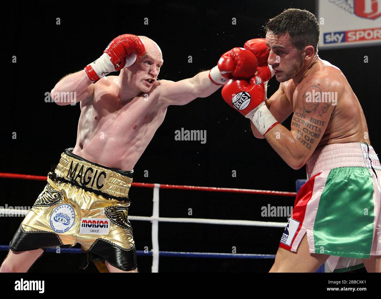 Matthew Hatton (gold/black shorts) fights Gianluca Branco for the ...