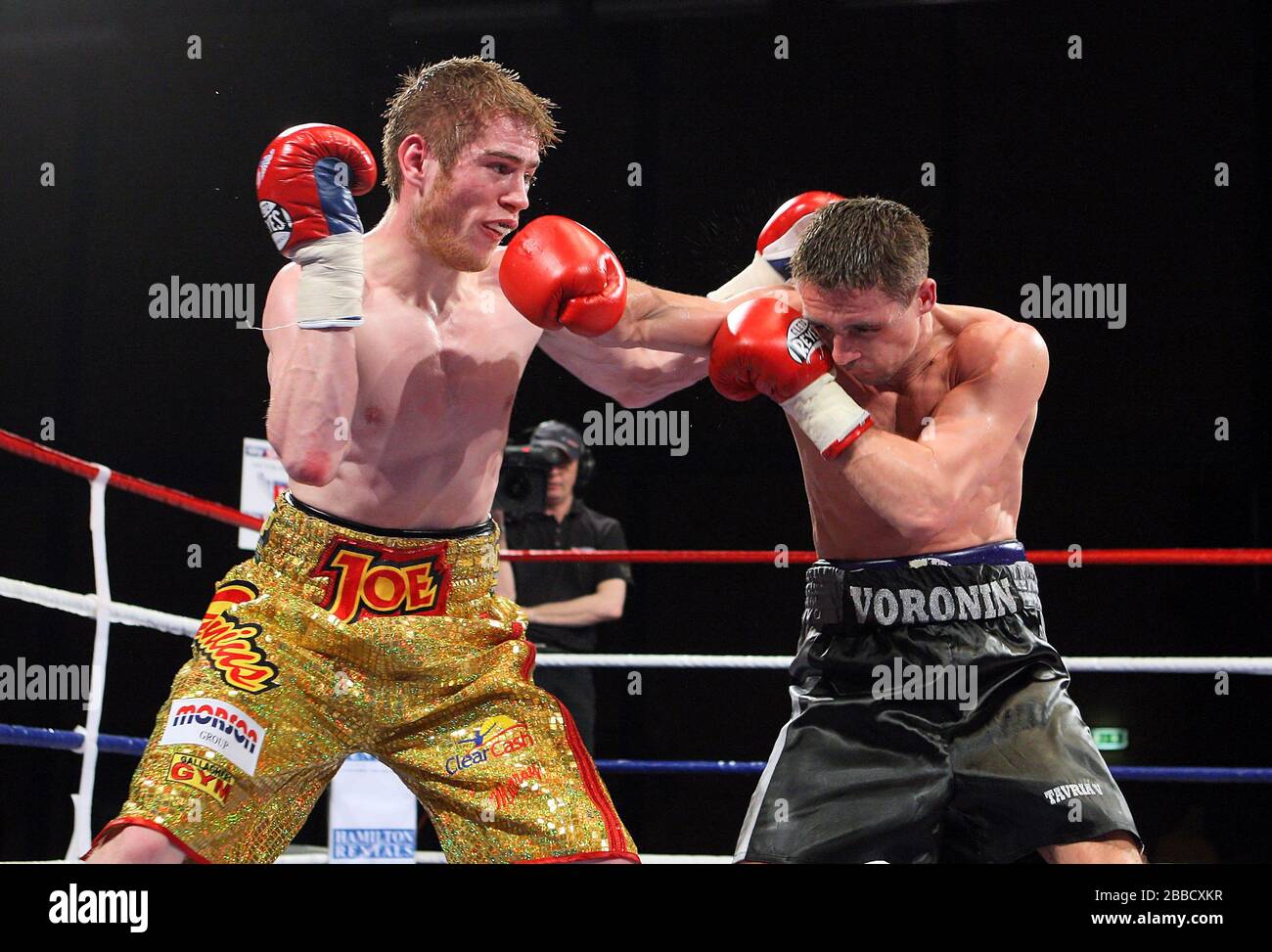 Joe Murray (gold shorts) defeats Yuri Voronin in a Super-Bantamweight ...