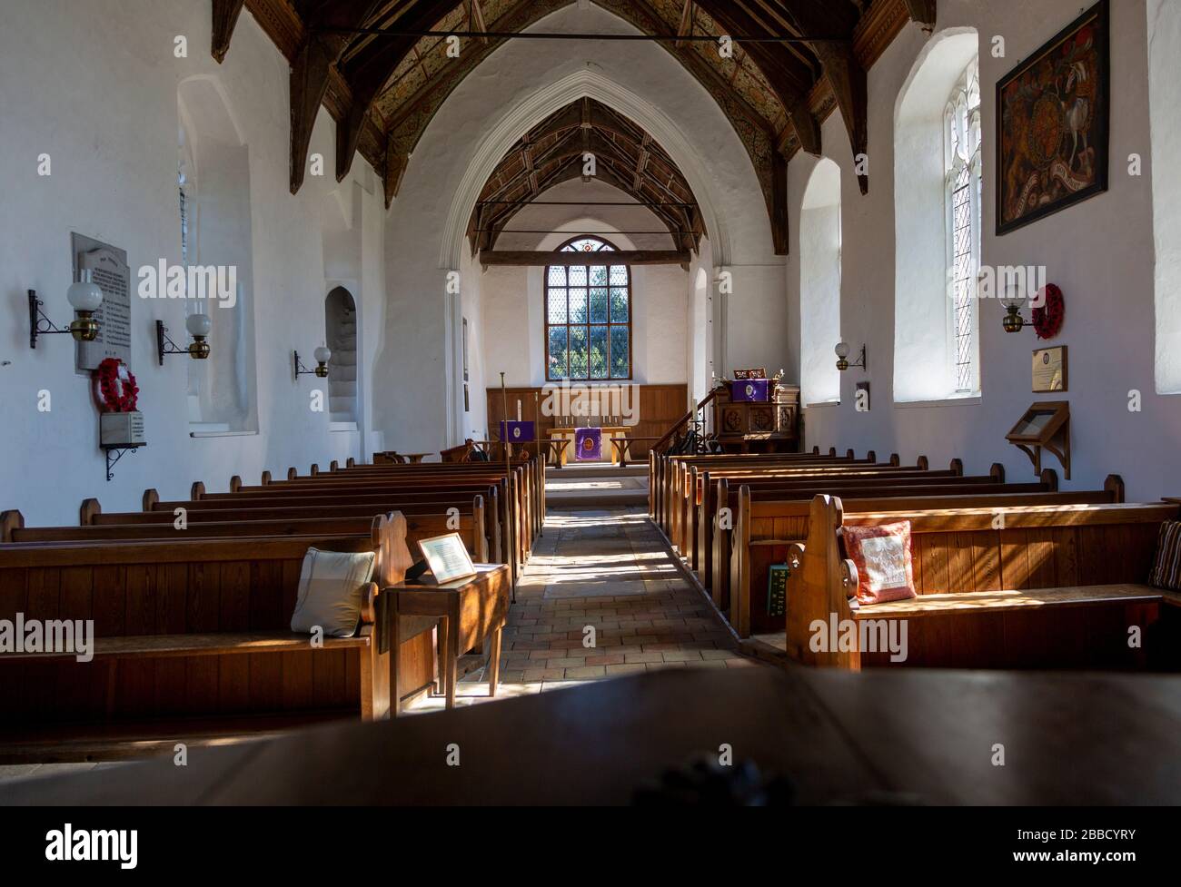 Interior of church view of nave to chancel altar and east window ...