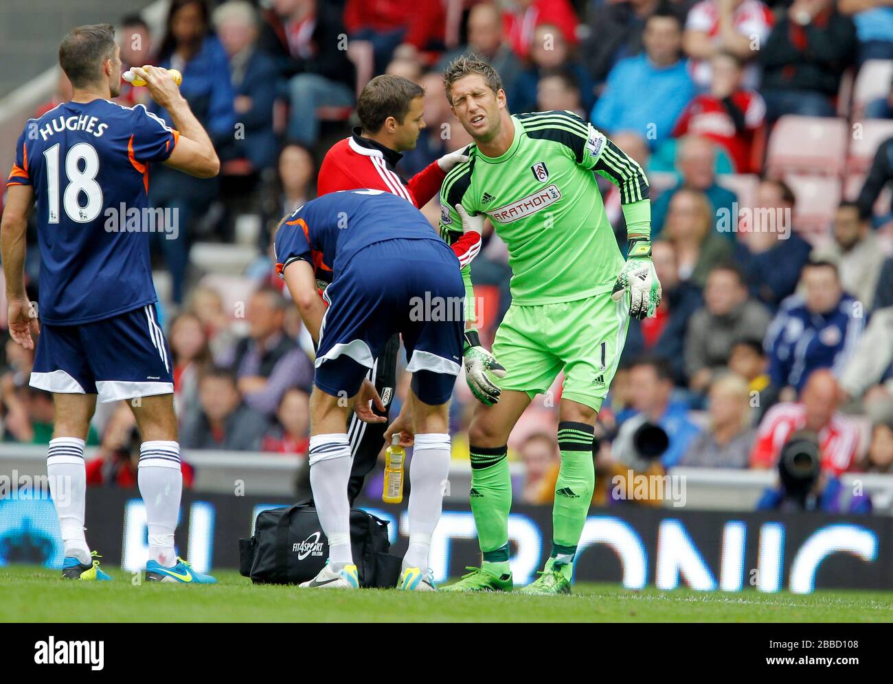 Fulham goalkeeper Maarten Stekelenburg winces in pain Stock Photo - Alamy