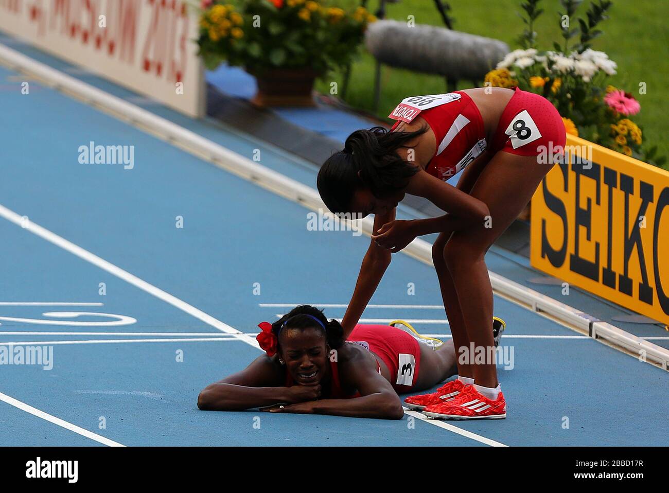 USA's Ajee Wilson (right) checks on compatriot Alysia Johnson Montano ...