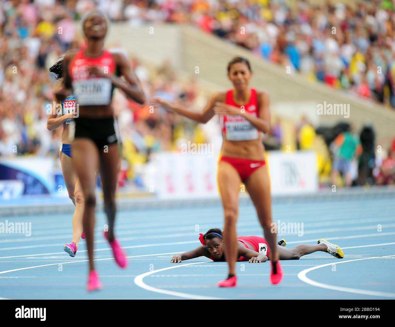 USA's Alysia Johnson Montano lies on the floor after falling at the ...