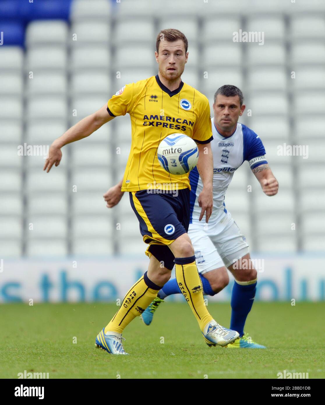 Brighton & Hove Albion's Ashley Barnes (front) shields the ball from ...