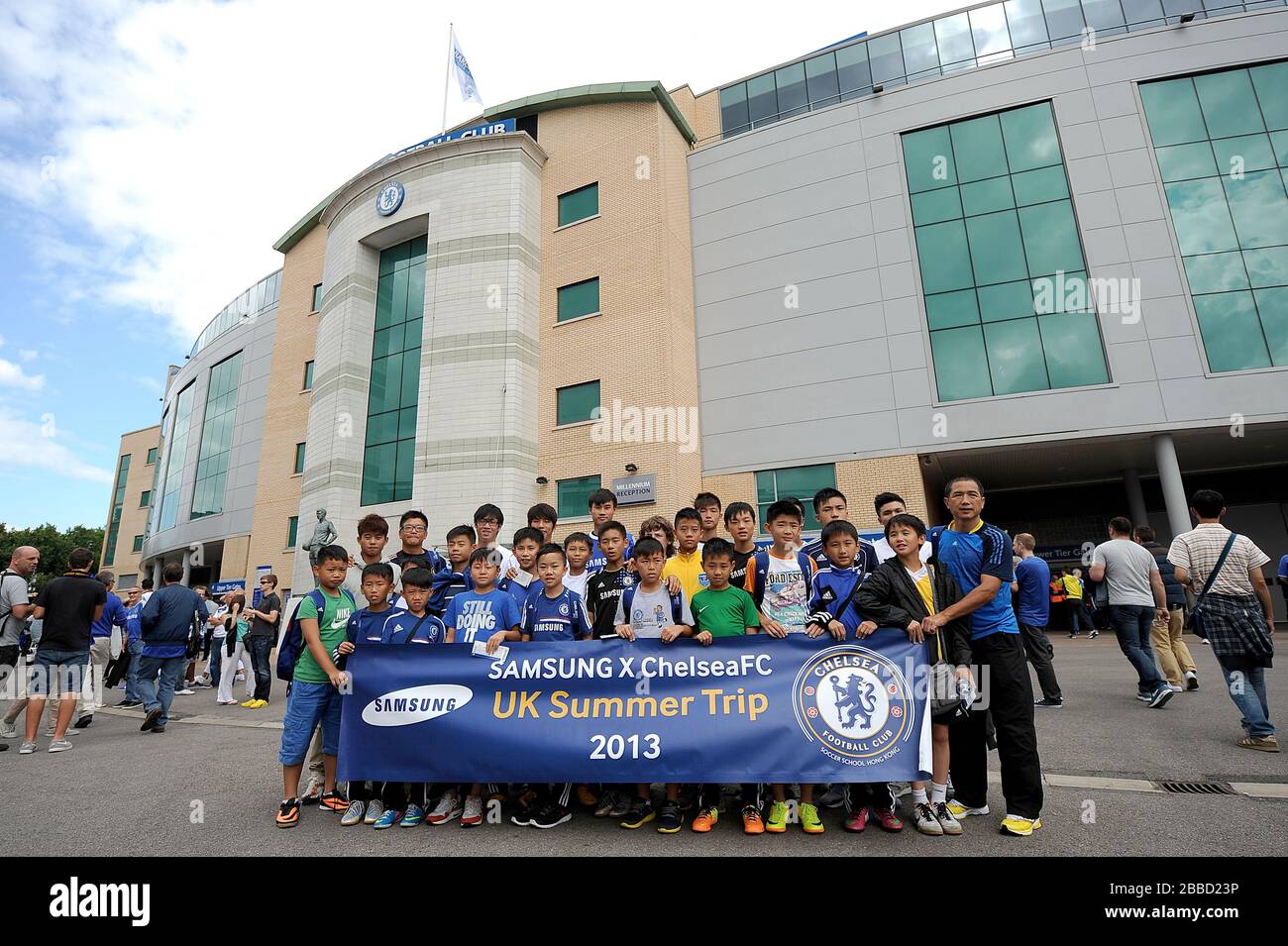 A group of Chelsea fans on tour pose for a photograph outside Stamford ...