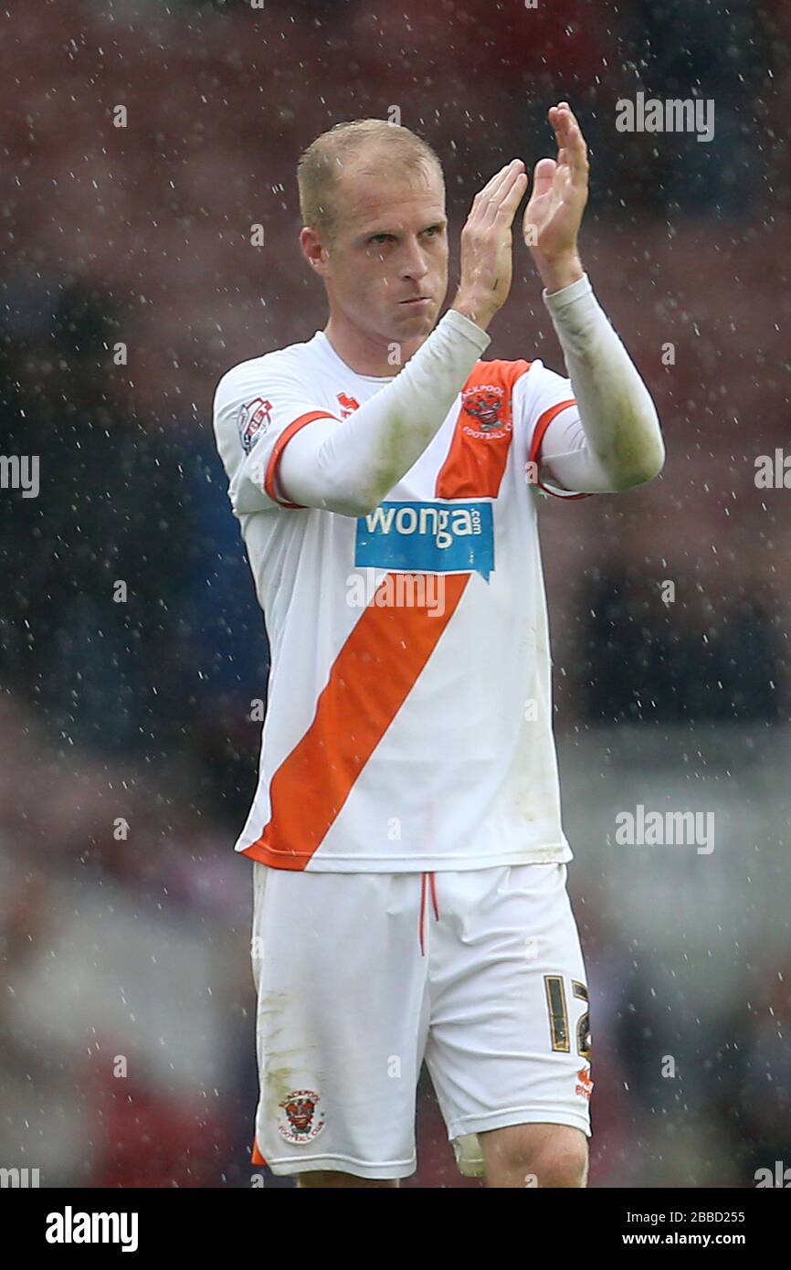 Blackpool's Neal Bishop applauds away fans after the final whistle ...