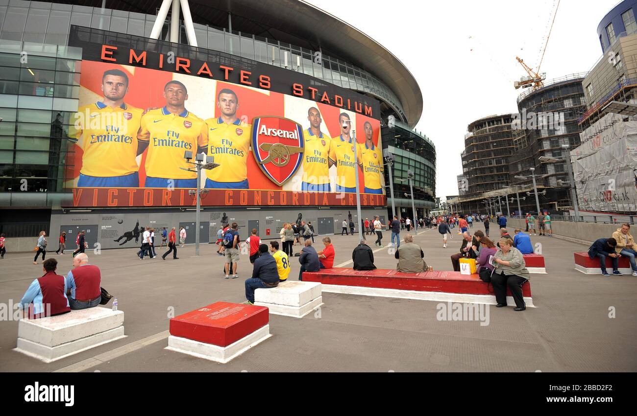 Fans make their way to the stadium before kick off hi-res stock ...
