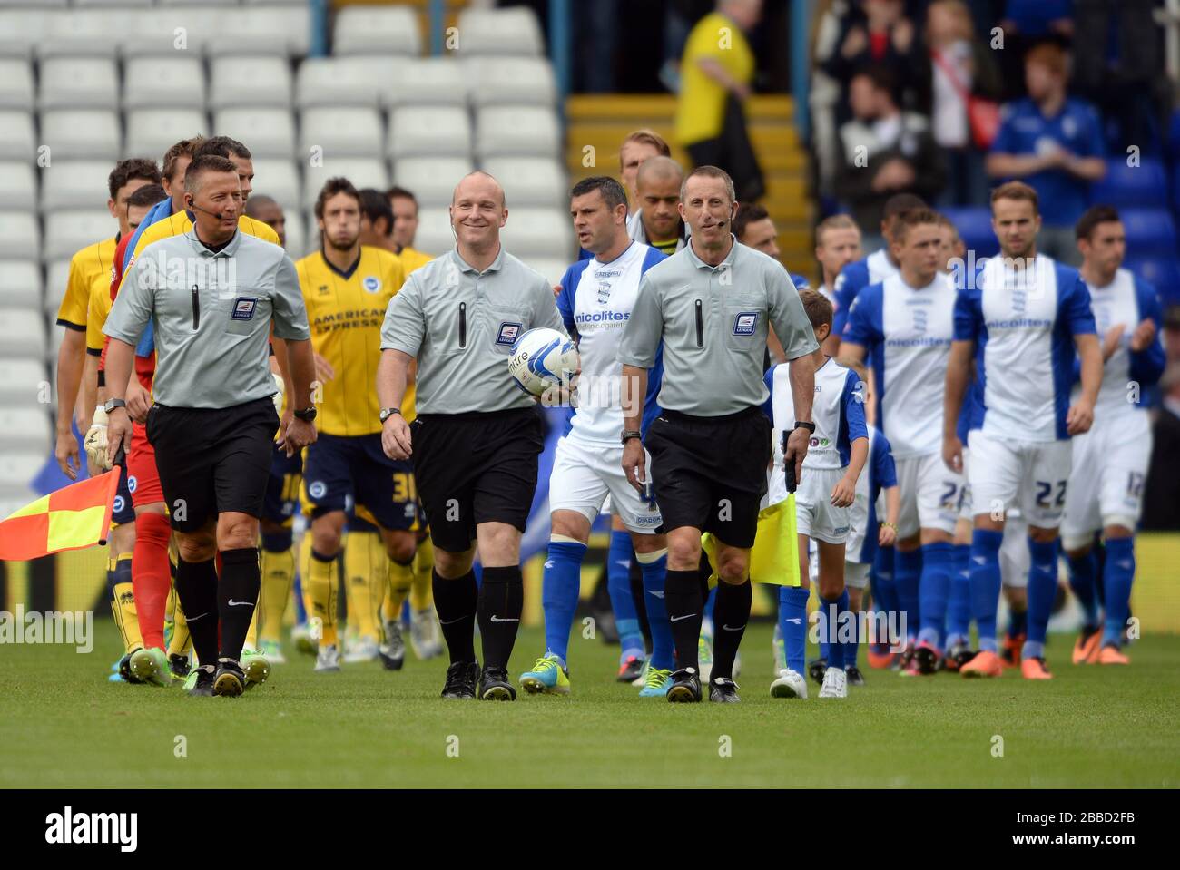 Referee Simon Hooper walks out at St Andrew's with assistant referee ...