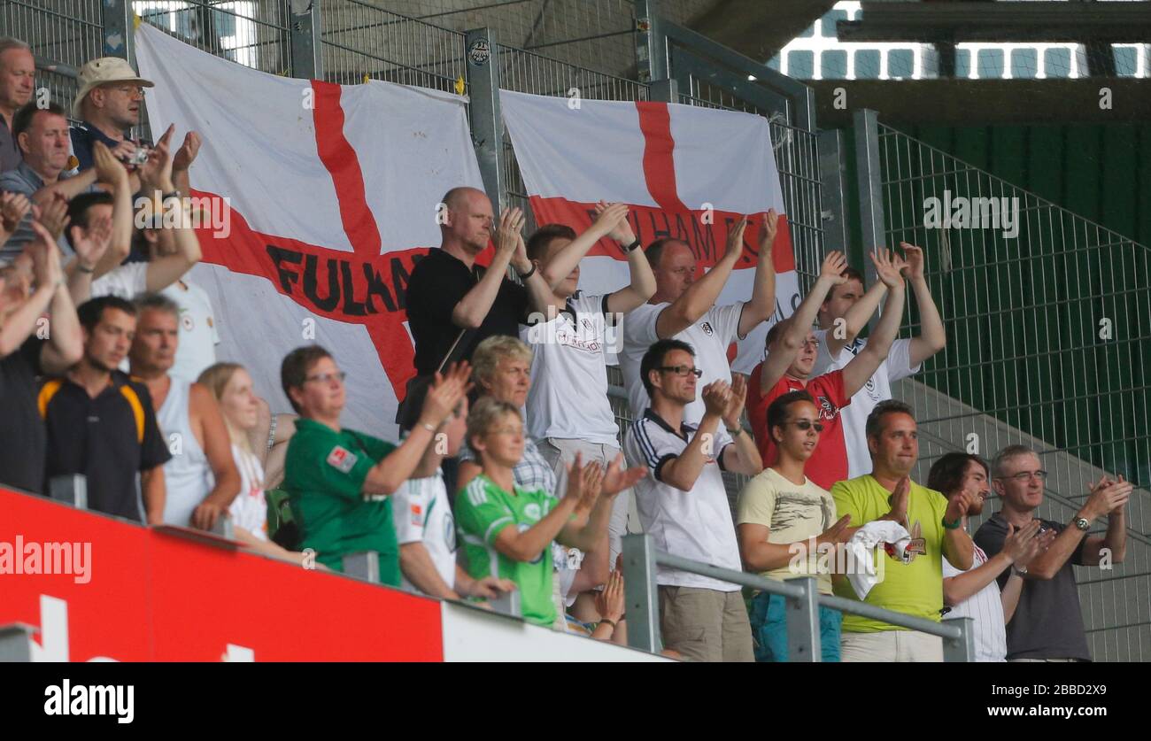 Fulham fans in the stands Stock Photo - Alamy