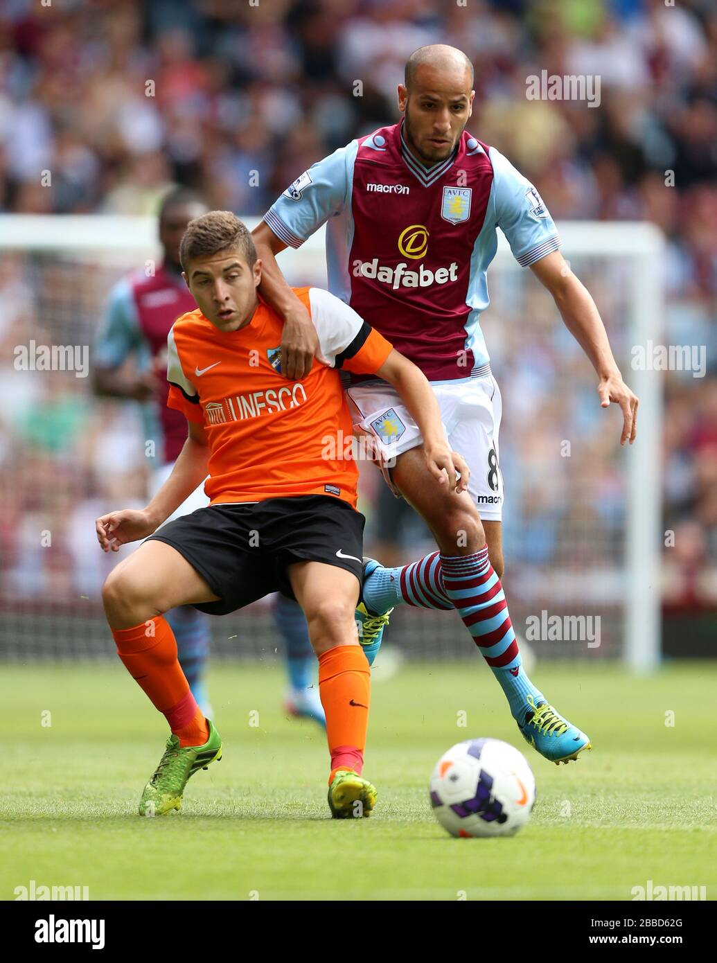 Aston Villa's Karim El Ahmadi (right) and Malaga's Francisco Portillo ...