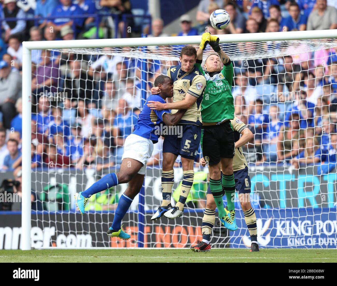 Leicester City's Wes Morgan jumps for the ball with Leeds United's ...