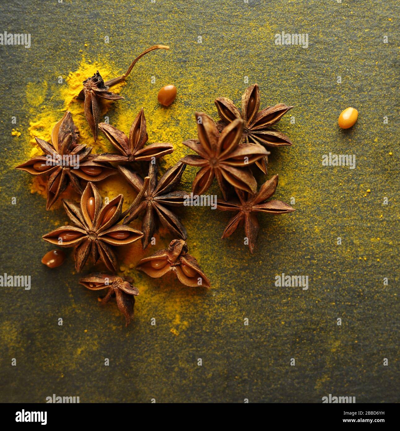 Composition with anise stars on dark background with anise seed. Top ...