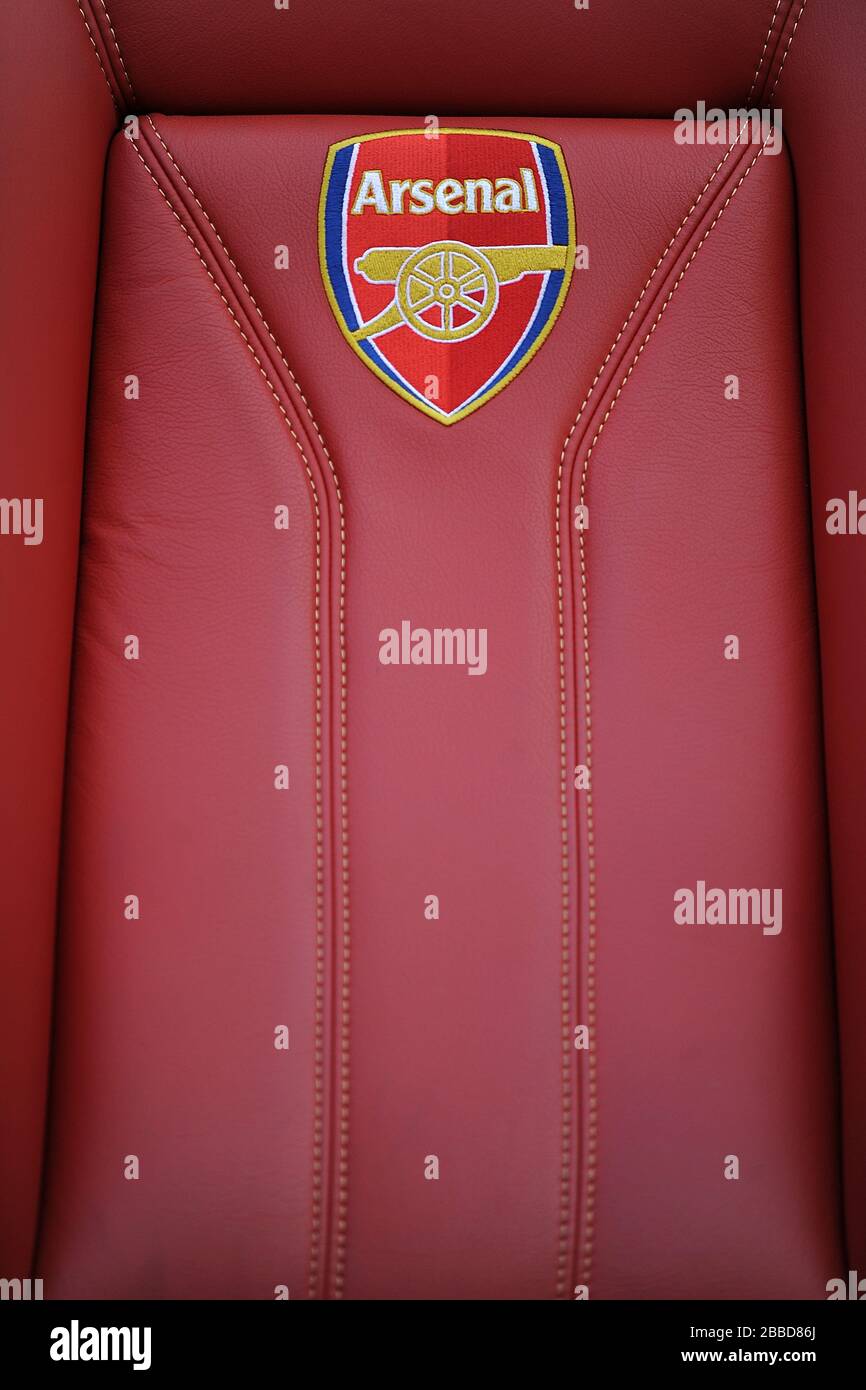Arsenal branding on the dugout seats Stock Photo - Alamy
