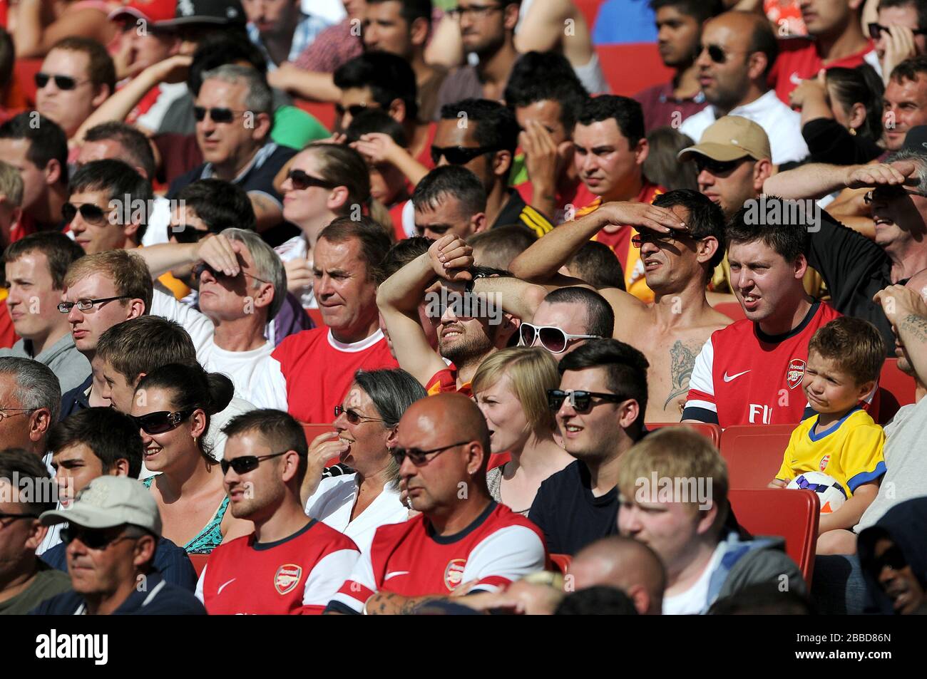 A packed stand at the Emirates Stadium as football fans enjoy the game ...