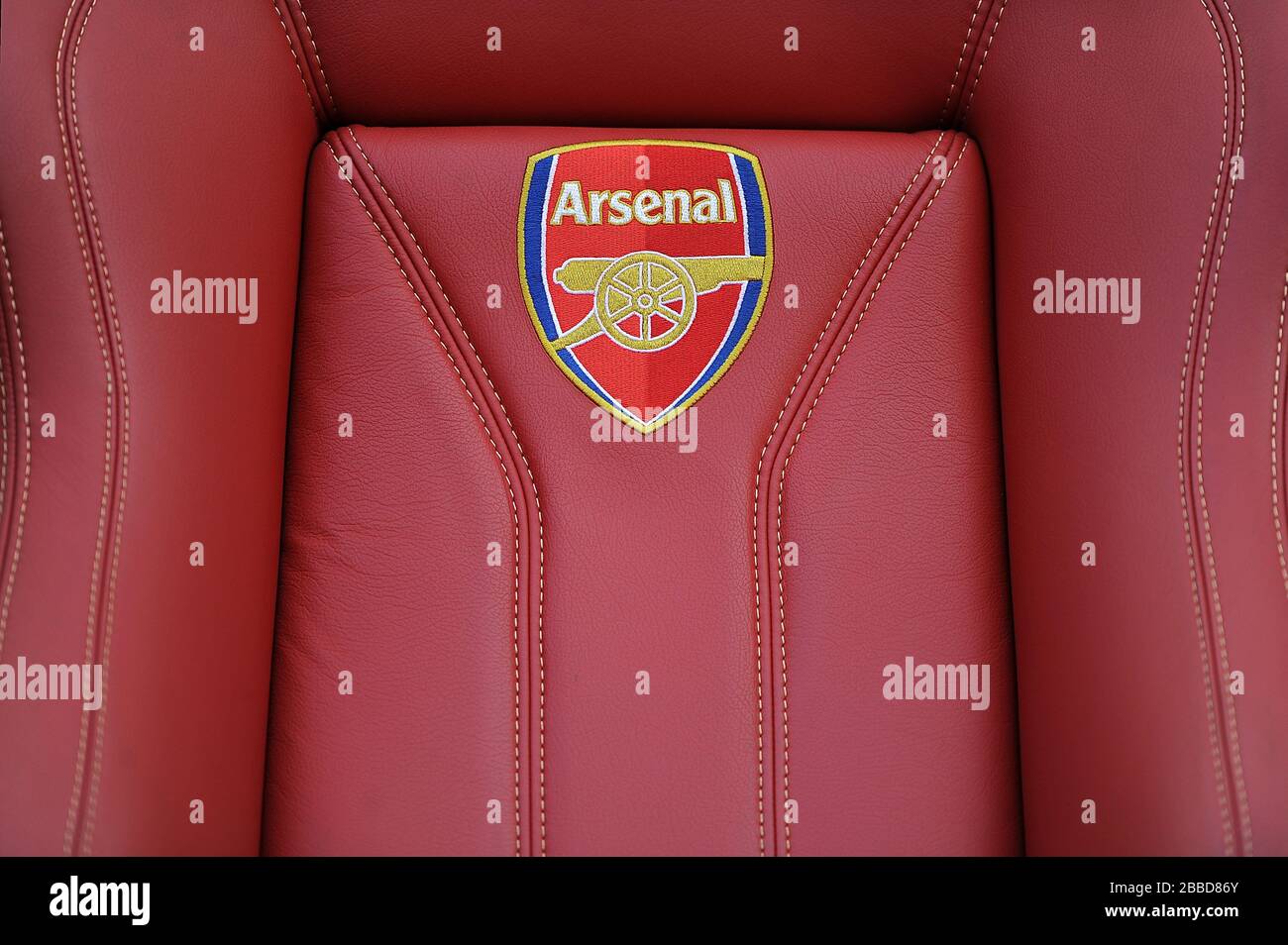 Arsenal branding on the dugout seats Stock Photo - Alamy
