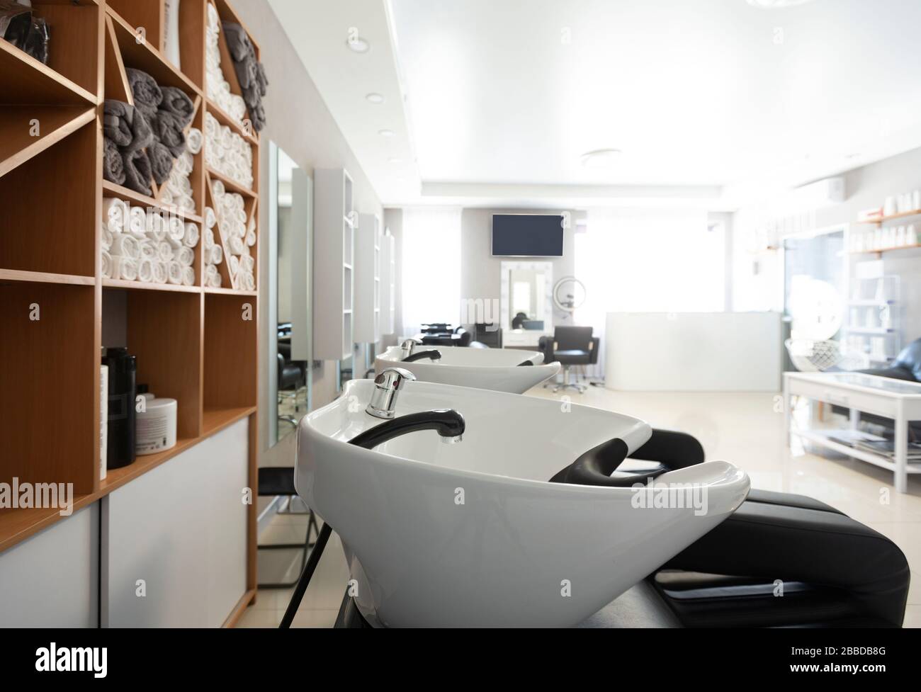 Wash sink in interior of hairdressing salon Stock Photo - Alamy