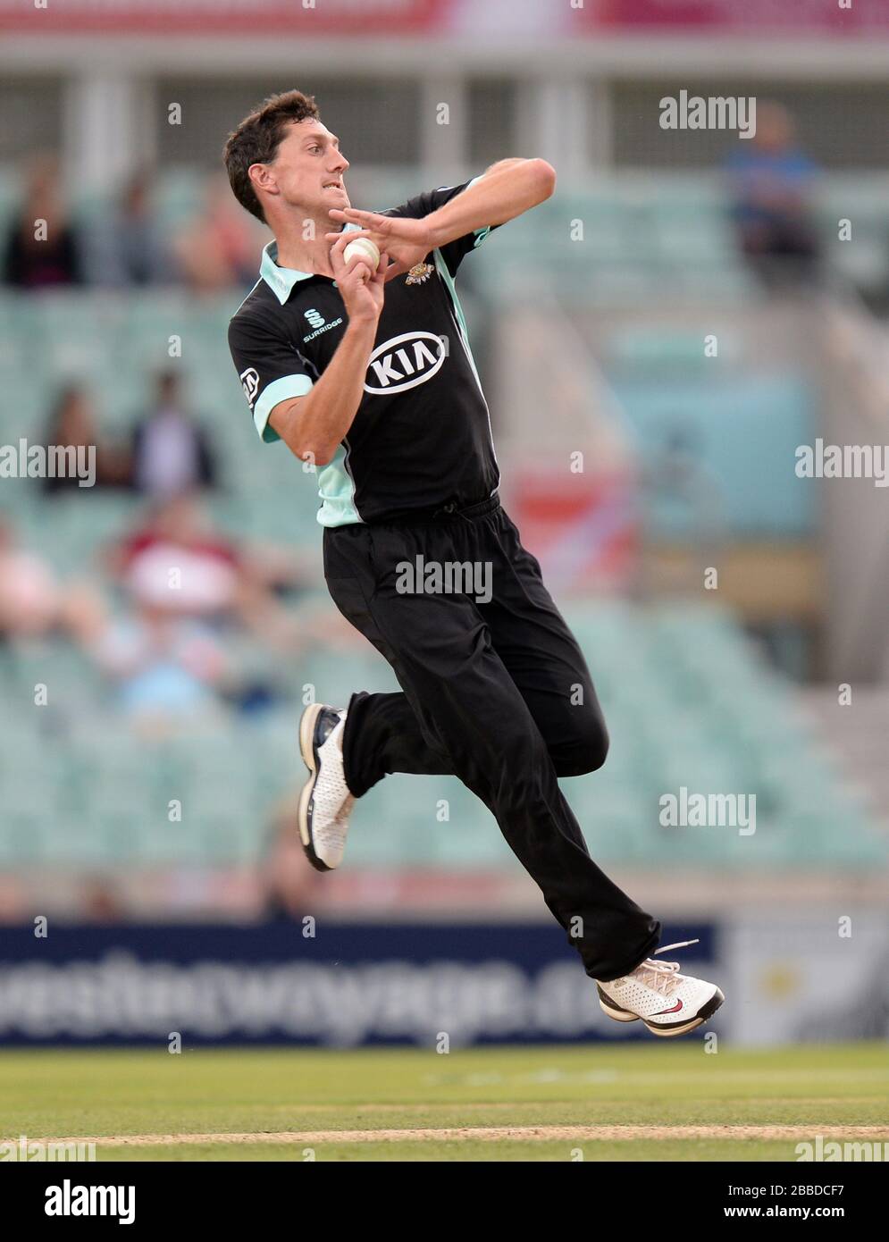 Surrey's Jon Lewis bowls Stock Photo - Alamy