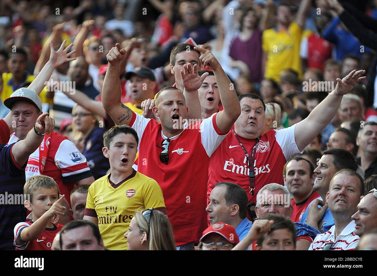 Arsenal fans in the stands Stock Photo - Alamy