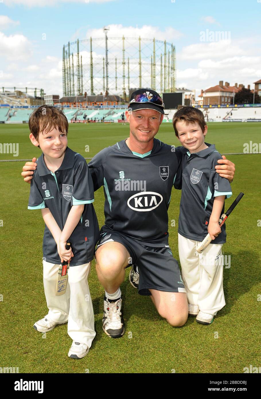 Surrey's Gary Keedy with the match day mascots Stock Photo - Alamy