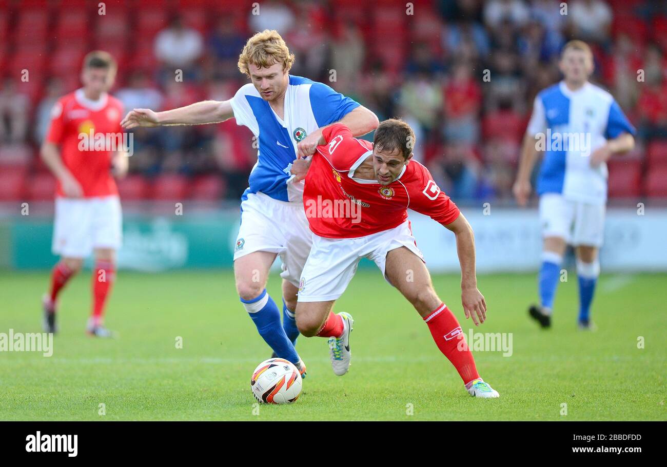 Blackburn Rovers Chris Marrow (left) battles for the ball with Crewe ...